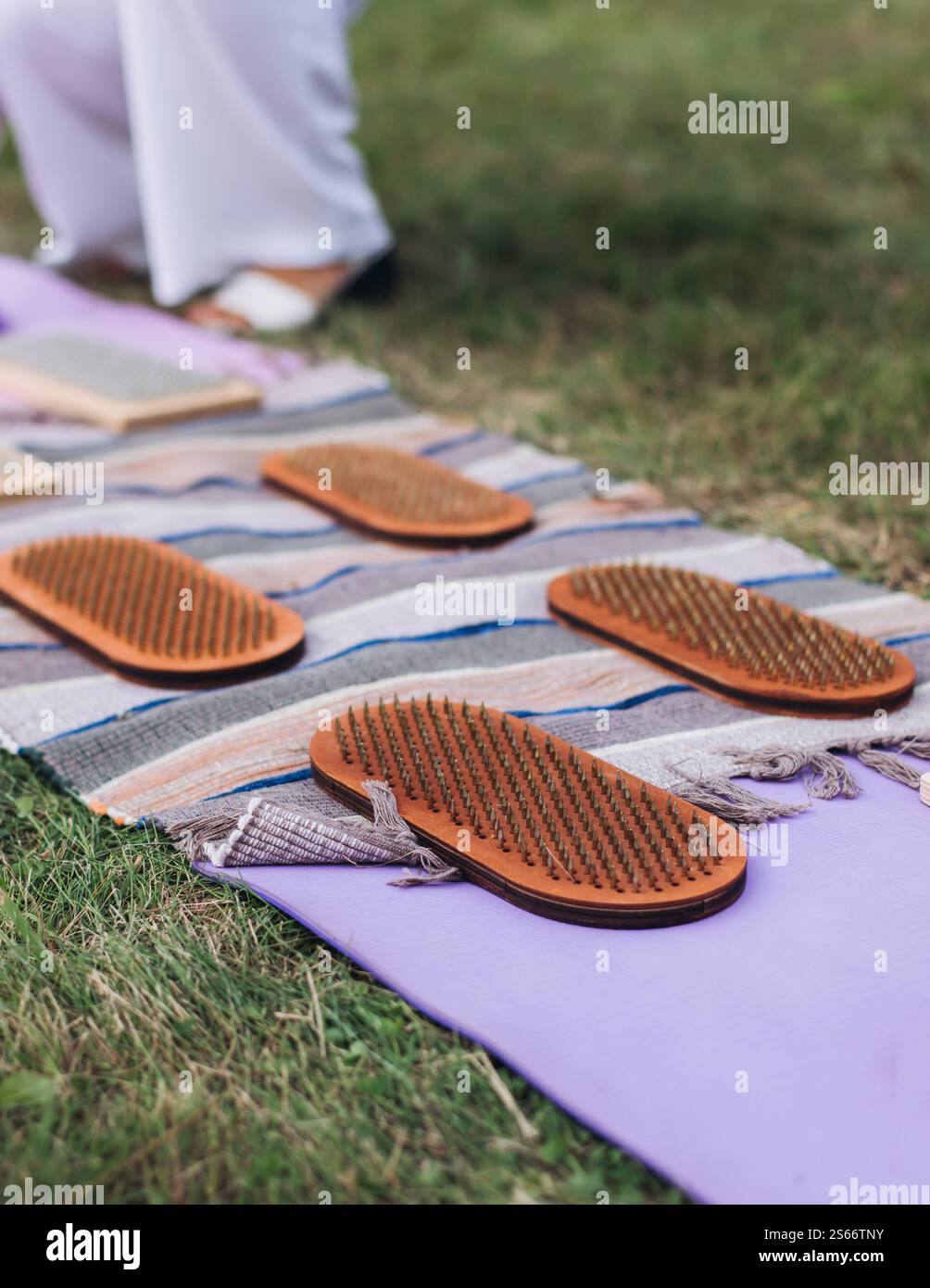 Standing on sadhu board, process of barefoot standing on nails therapy ...
