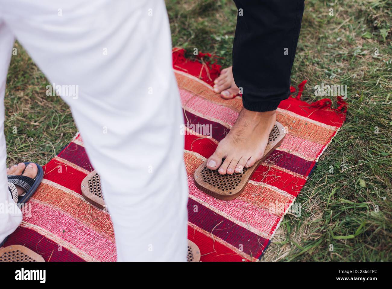 Standing on sadhu board, process of barefoot standing on nails therapy ...