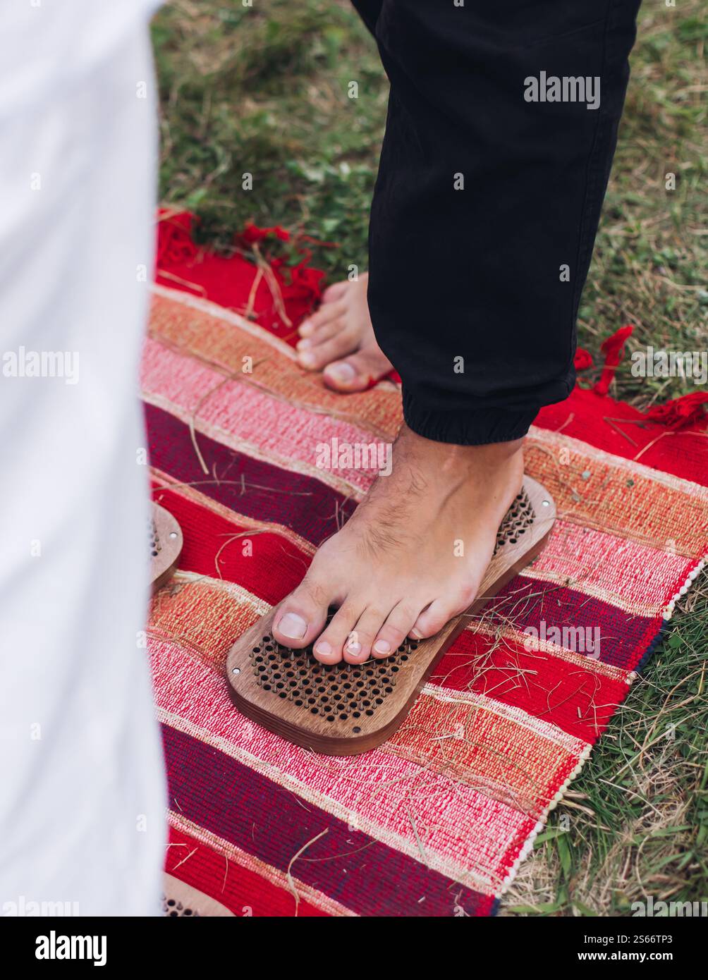 Standing on sadhu board, process of barefoot standing on nails therapy ...