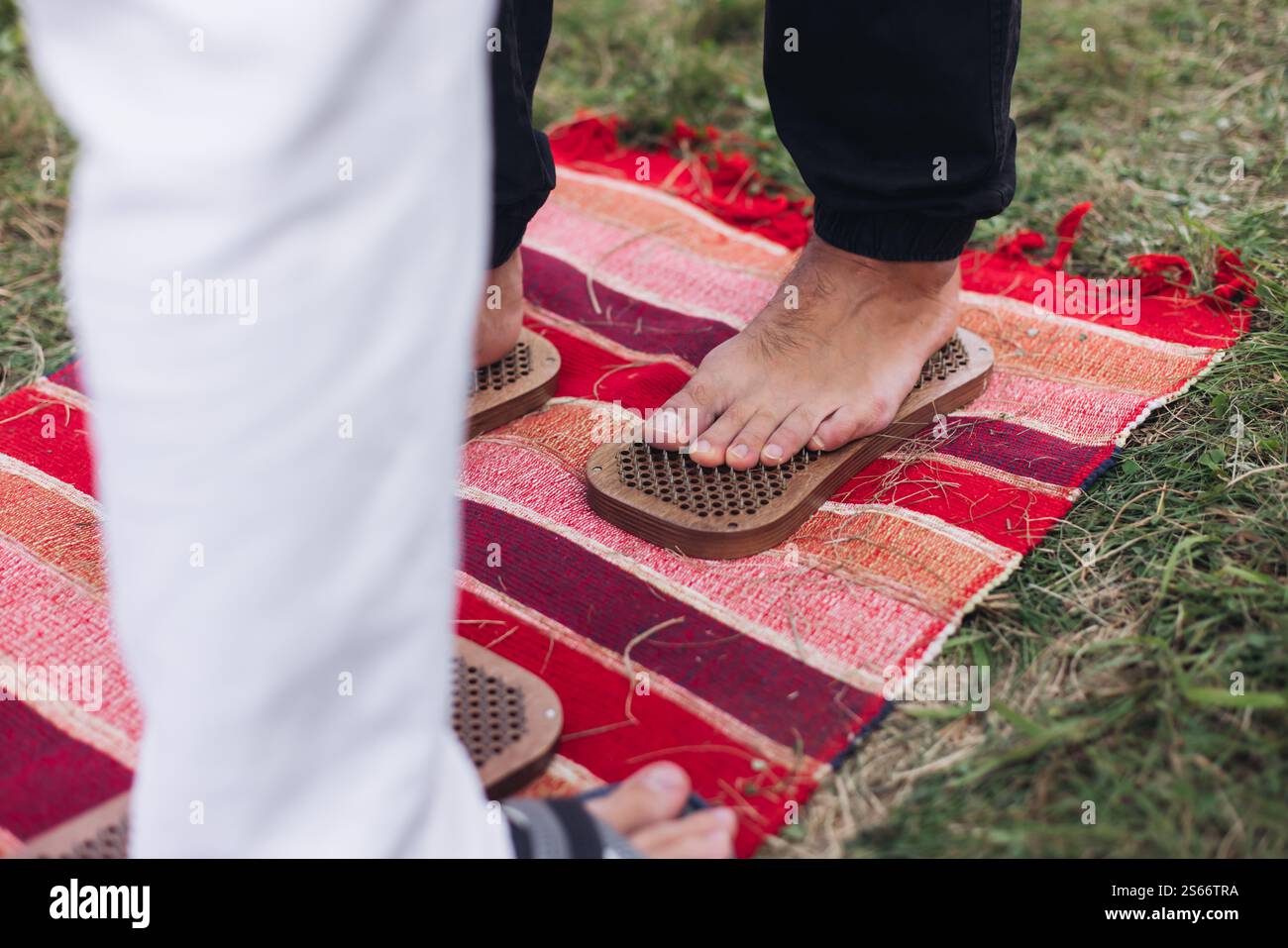 Standing on sadhu board, process of barefoot standing on nails therapy ...