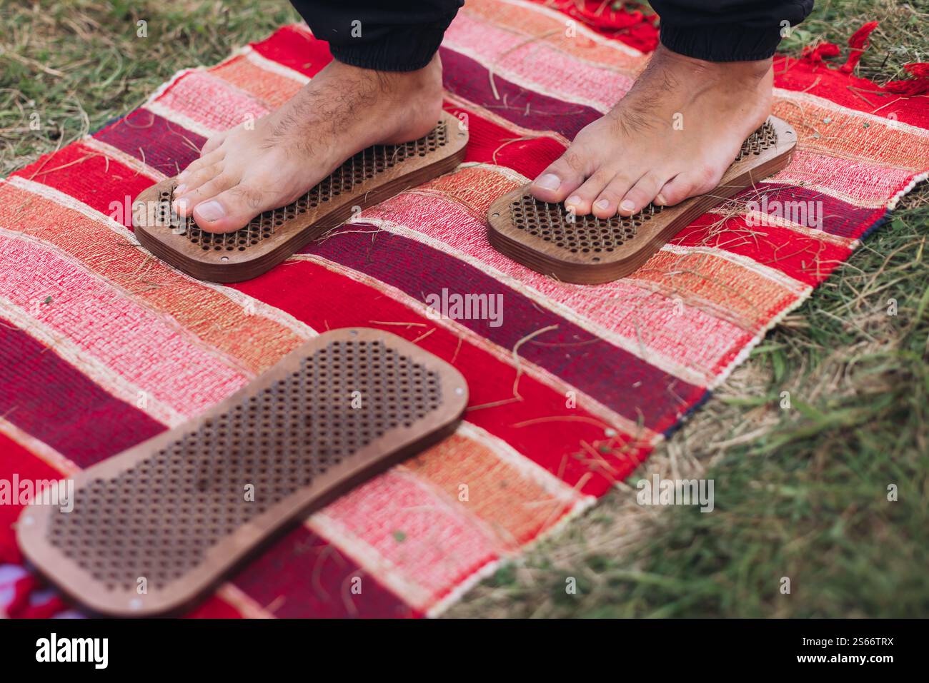 Standing on sadhu board, process of barefoot standing on nails therapy ...