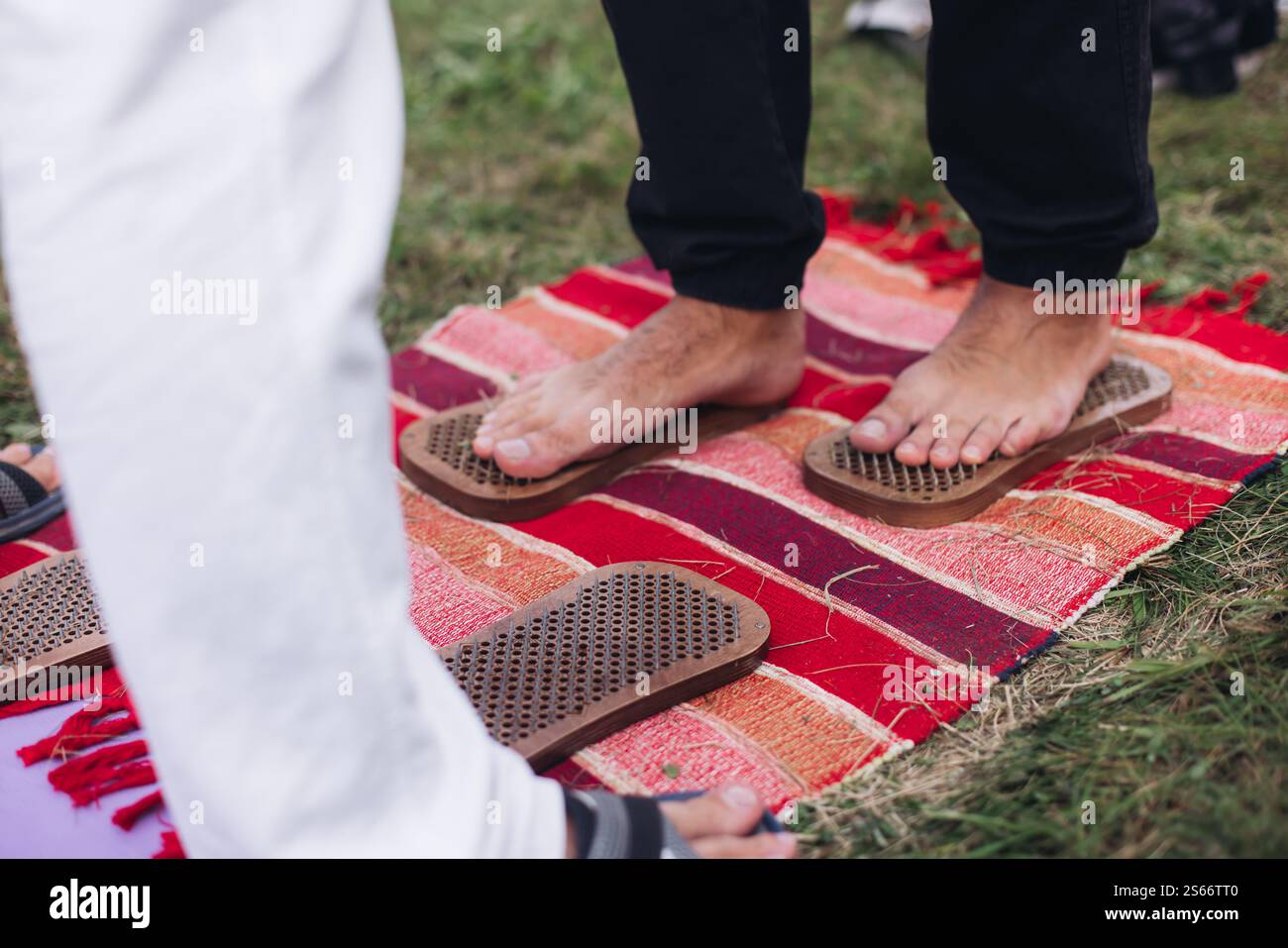 Standing on sadhu board, process of barefoot standing on nails therapy ...