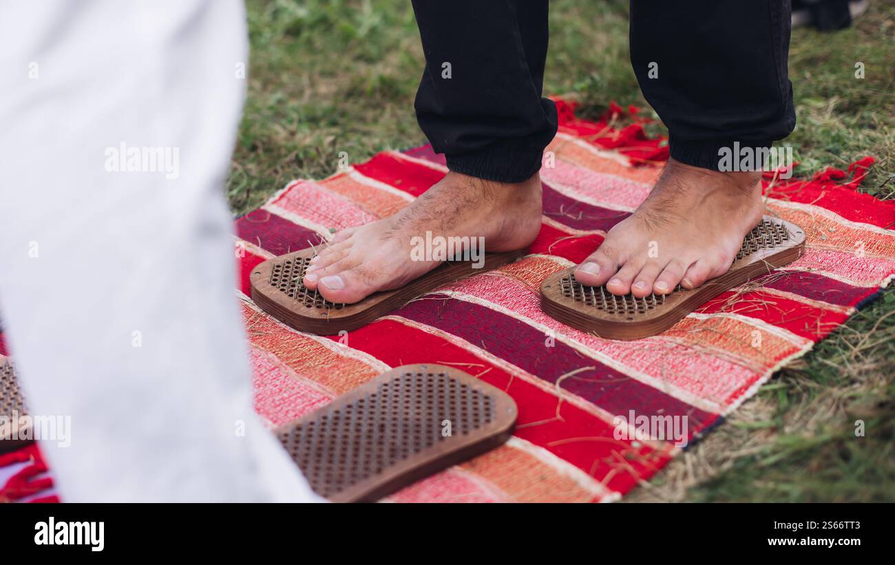 Standing on sadhu board, process of barefoot standing on nails therapy ...