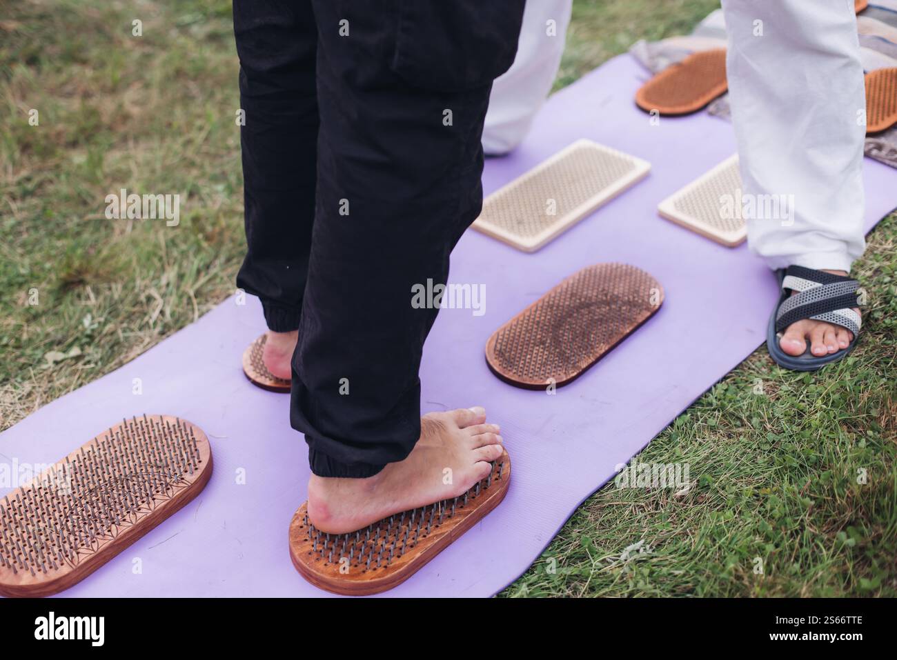 Standing on sadhu board, process of barefoot standing on nails therapy ...