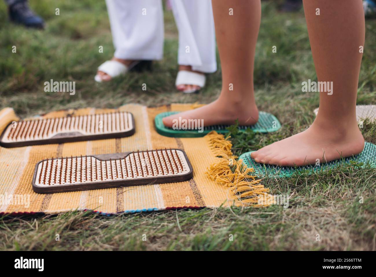 Standing on sadhu board, process of barefoot standing on nails therapy ...