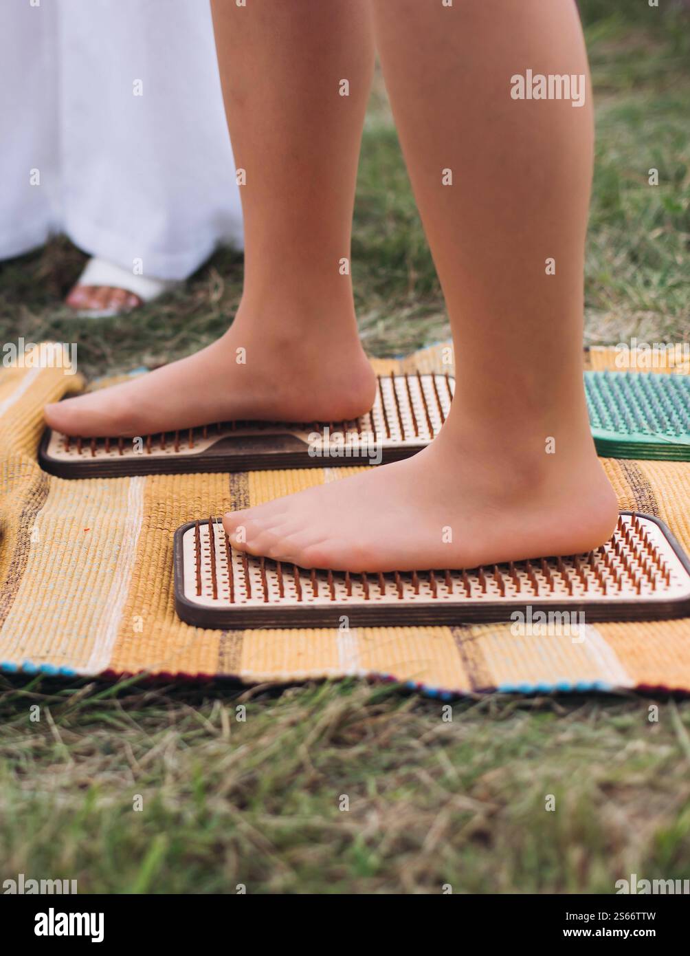 Standing on sadhu board, process of barefoot standing on nails therapy ...