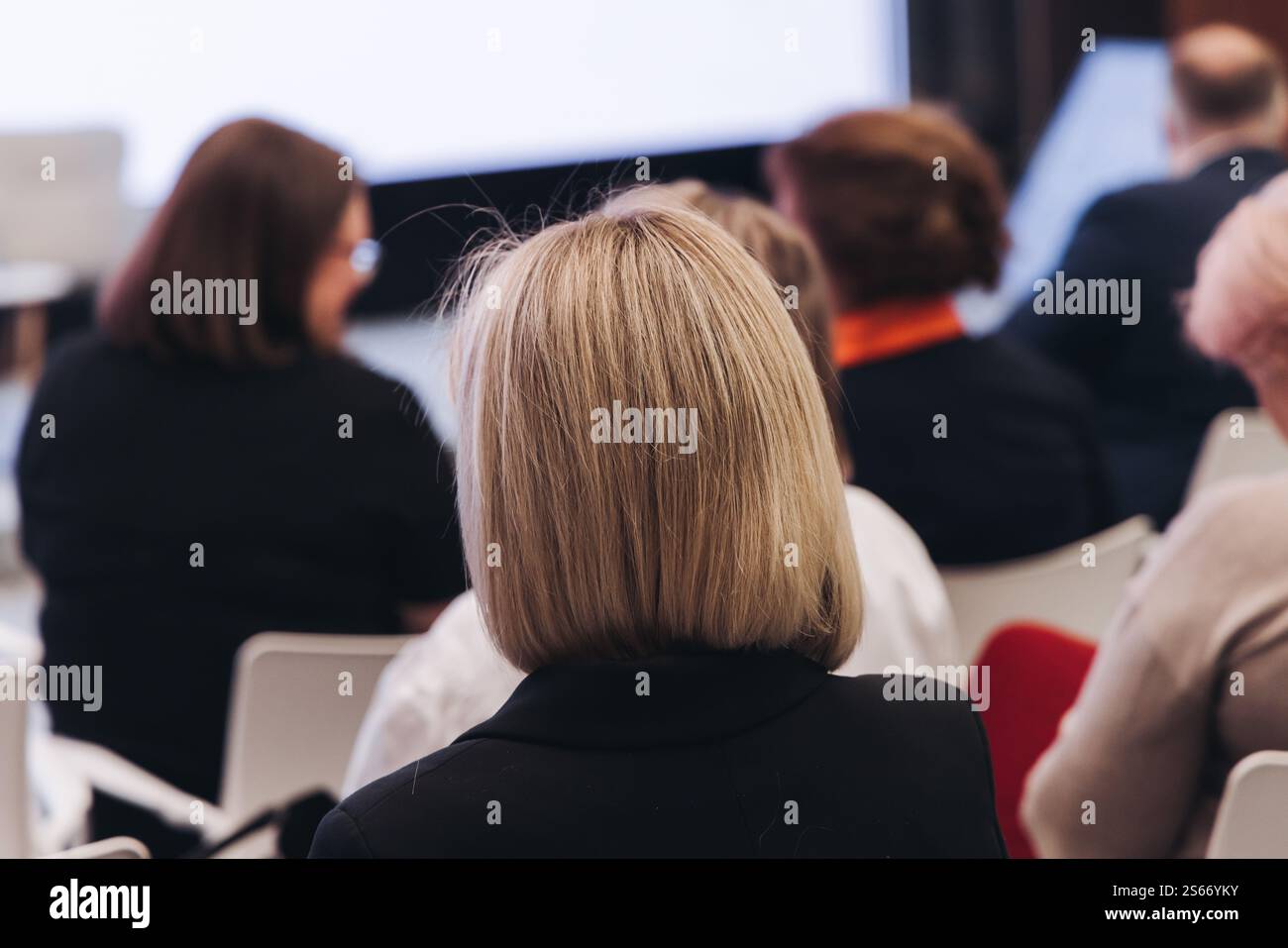 Female audience at the symposyum meeting, participants attendees in ...