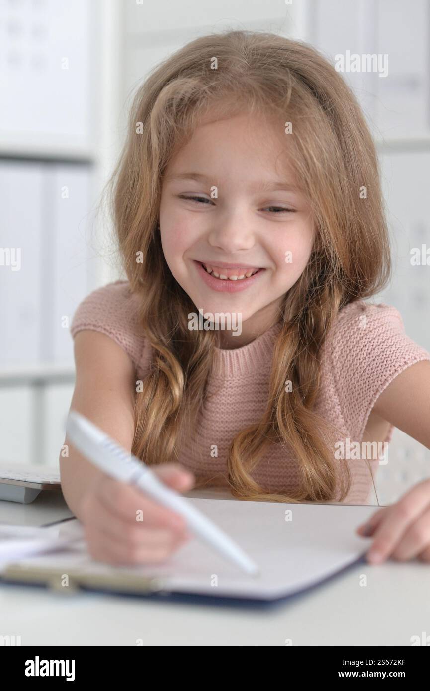 Cute and happy little girl children using laptop computer Stock Photo ...