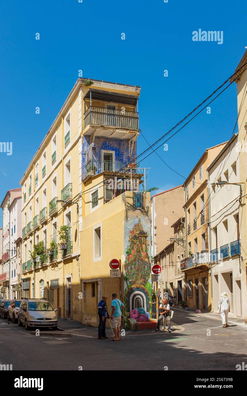Narrow corner building with murals, Sete, Herault, Occitanie, France ...