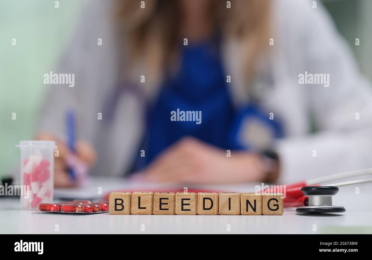 A healthcare professional is actively examining a patients bleeding ...