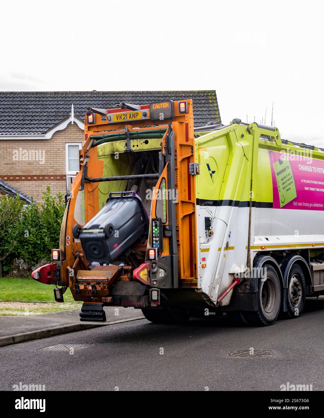 Waste collection lorry raising bin to empty position, Cherry Willingham ...