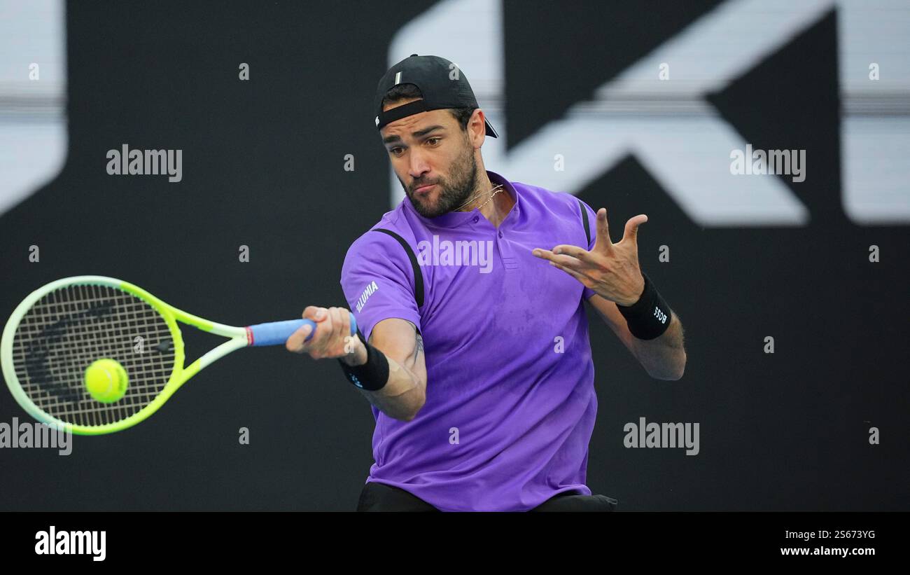 Matteo Berrettini of Italy returns a shot against Holger Rune of ...