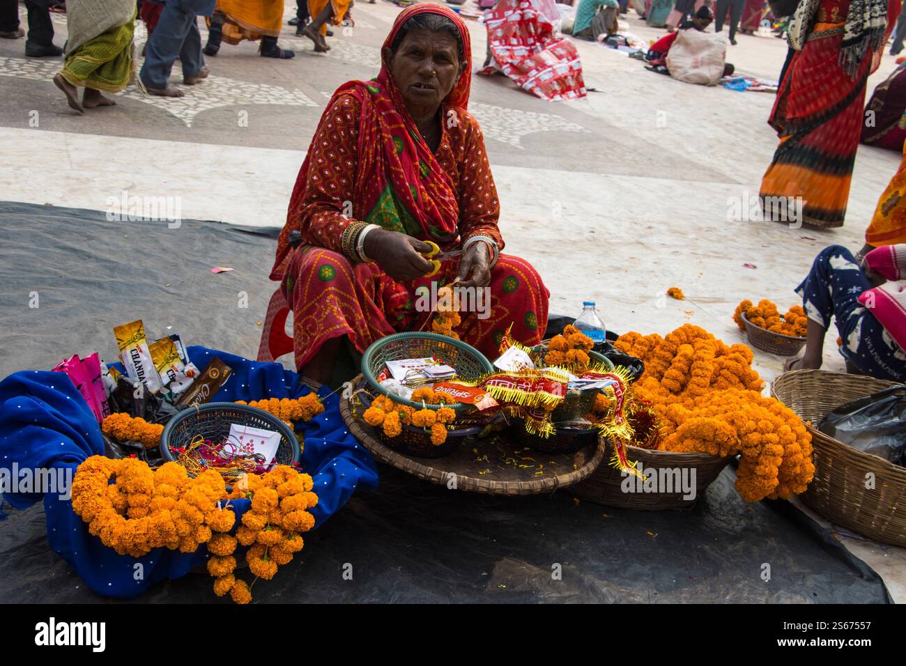 Indian and Nepali vendors sell flowers, tika, vermillion powder, sweets ...