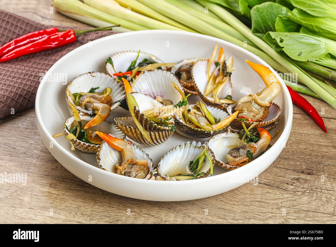 Delicous Asian mollusk shell steamed with spices Stock Photo - Alamy