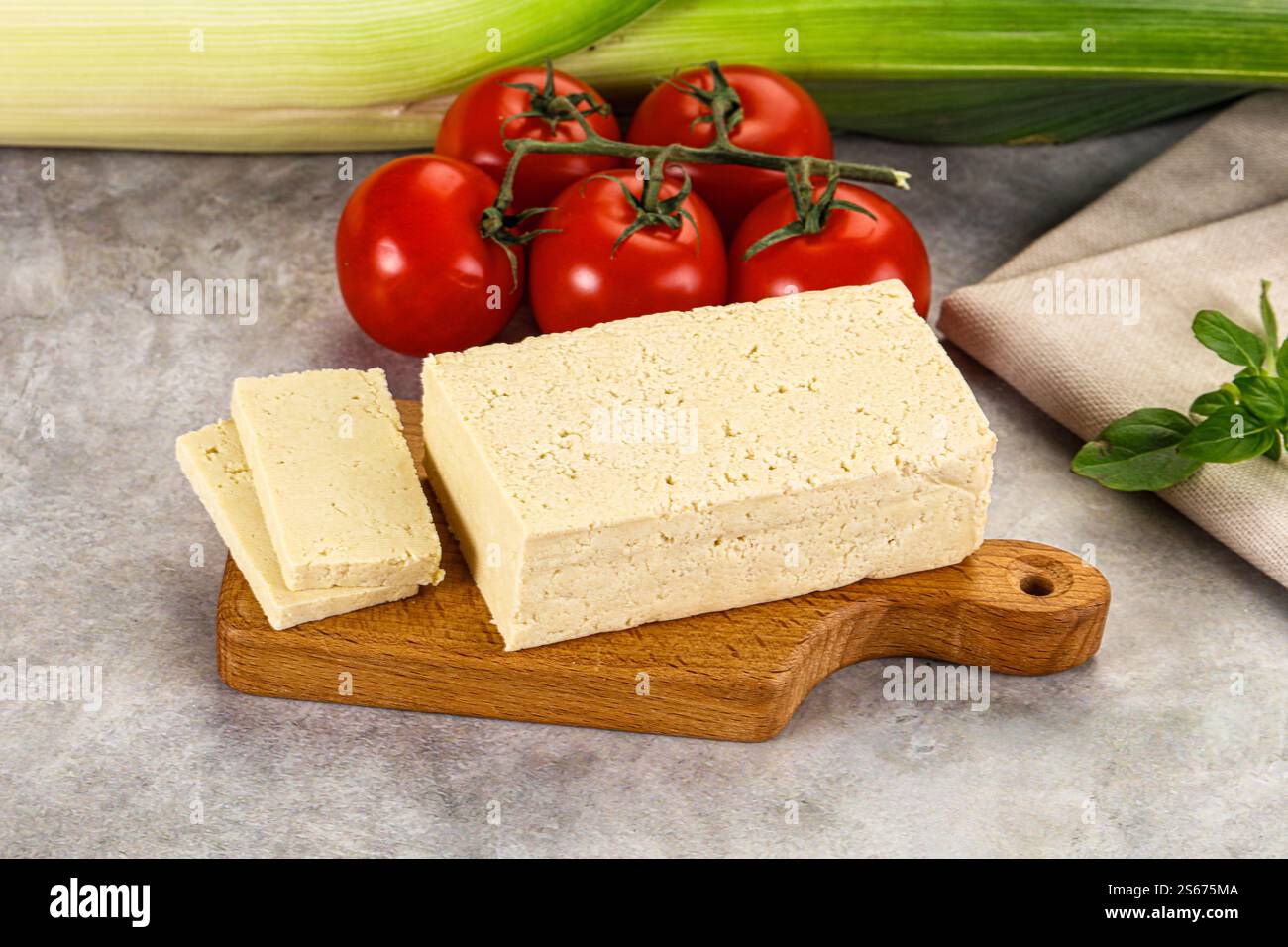 Soya vegan tofu cheese brick over board Stock Photo - Alamy