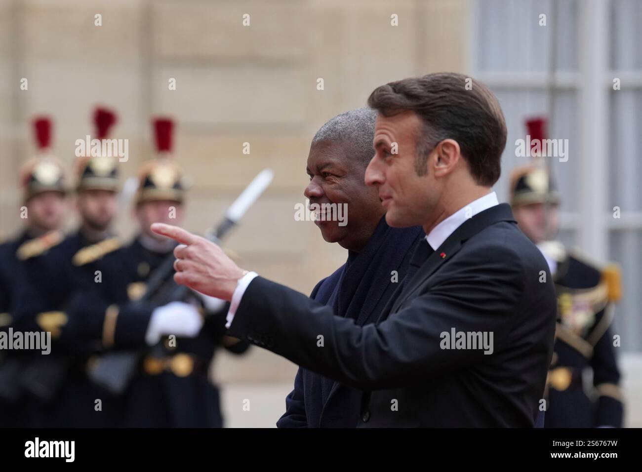French President Emmanuel Macron, right, welcomes Angola's President ...
