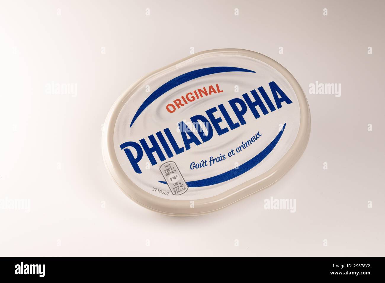 Creamy spread container resting on a neutral background with clean ...