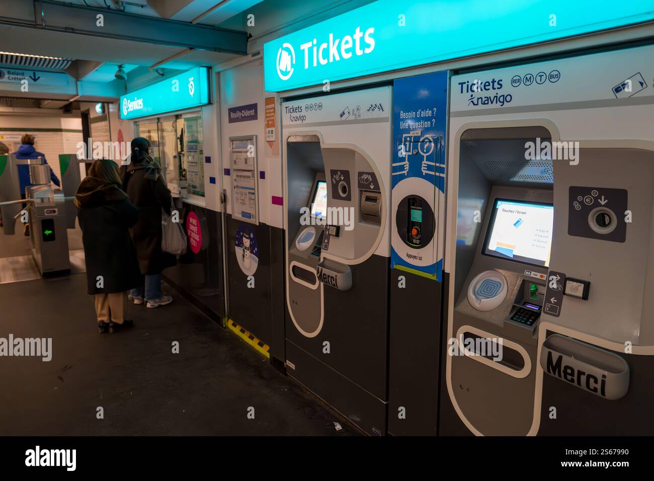 Ticket vending machines at a busy urban subway station during rush hour ...