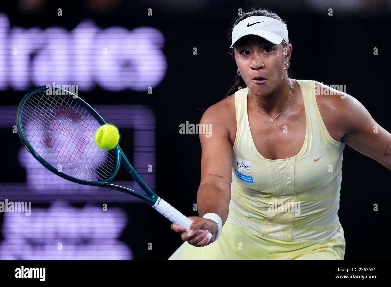Destanee Aiava of Australia plays a forehand return to Danielle Collins of the U.S. during their ...