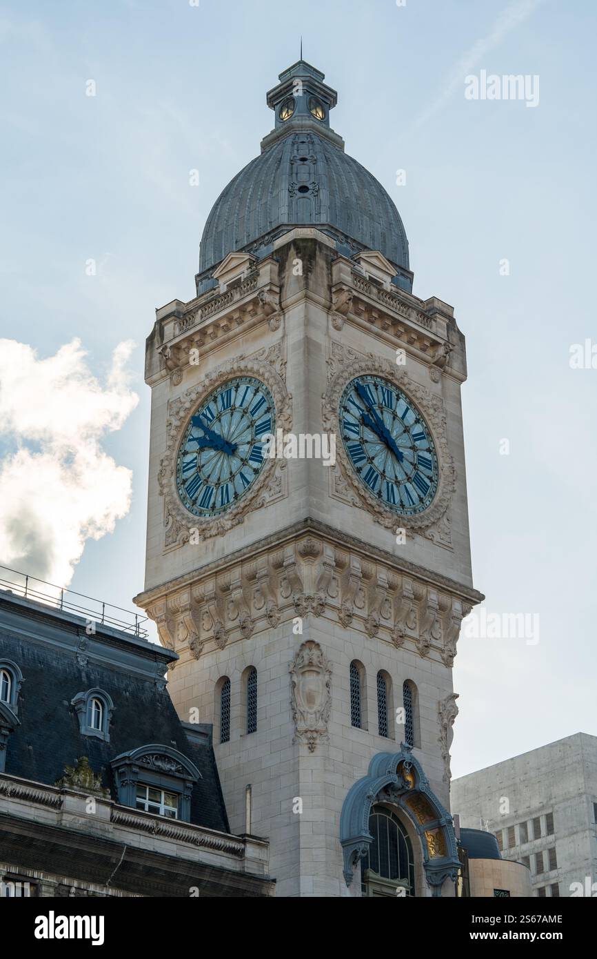 Historic clock tower standing tall against a clear sky in a city Stock ...