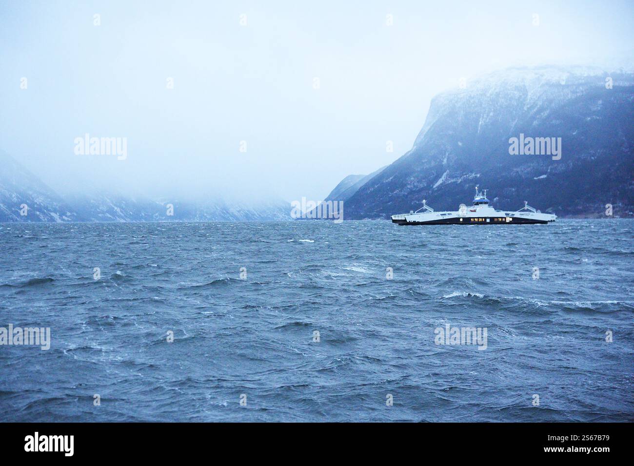 A breathtaking fjord surrounded by snow-capped mountains and rippling ...