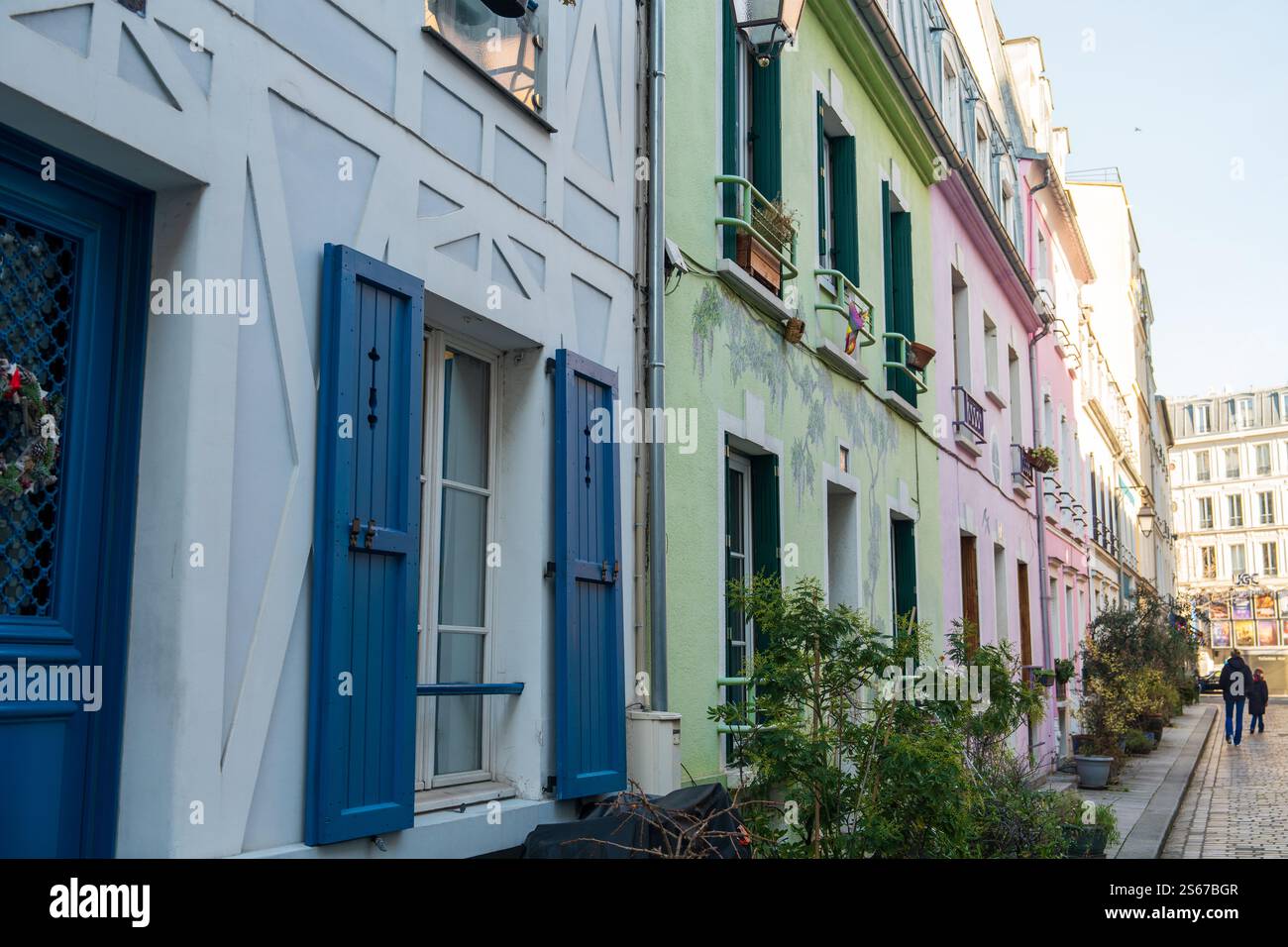 Colorful buildings line a charming street in a lively neighborhood of ...