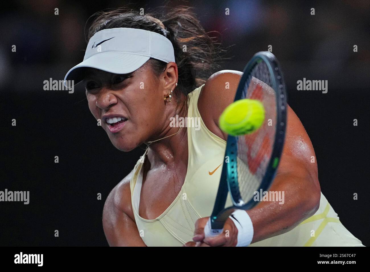 Destanee Aiava of Australia plays a backhand return to Danielle Collins of the U.S. during their ...