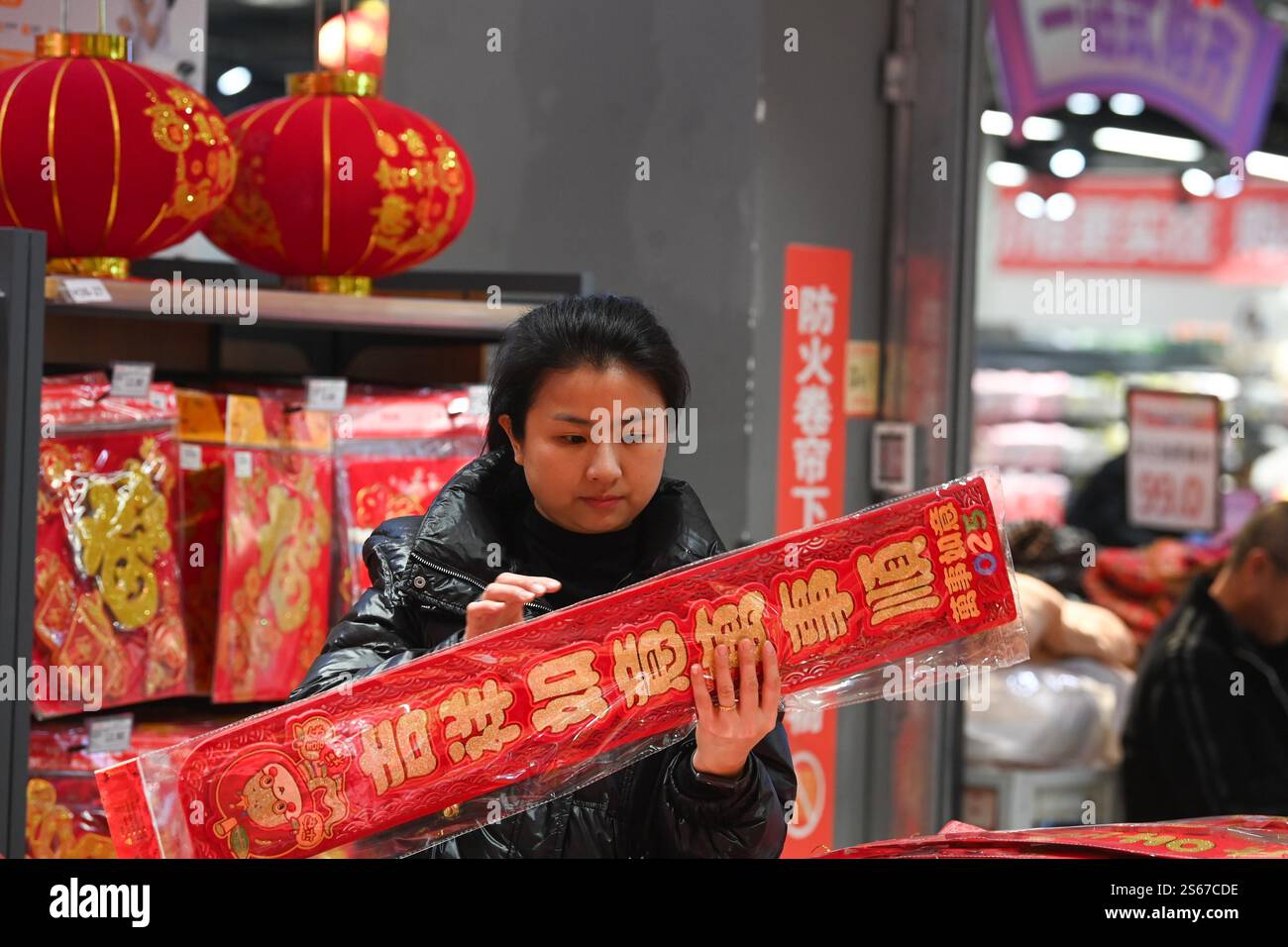 People select Spring Festival decorations in a market in Chongqing ...