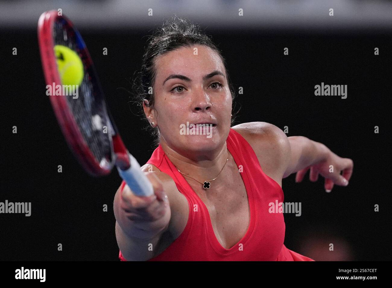 Elena-Gabriela Ruse of Romania plays a forehand return to Madison Keys ...