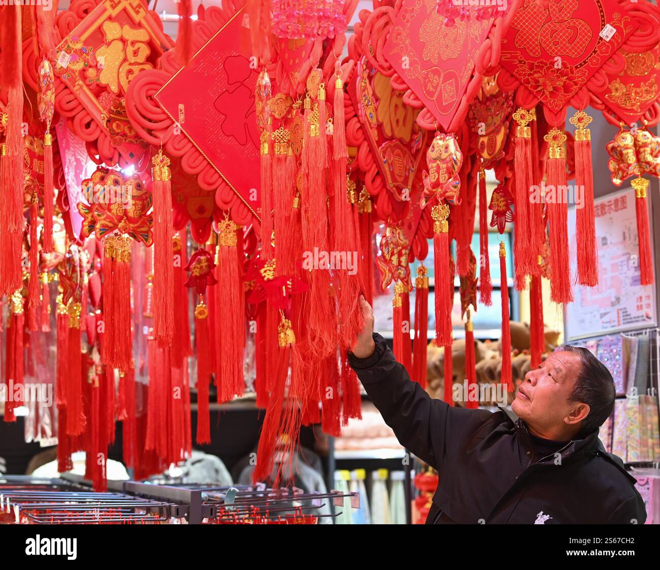 People select Spring Festival decorations in a market in Chongqing ...
