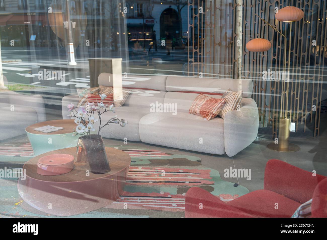 Modern living room design showcased through a large storefront window ...