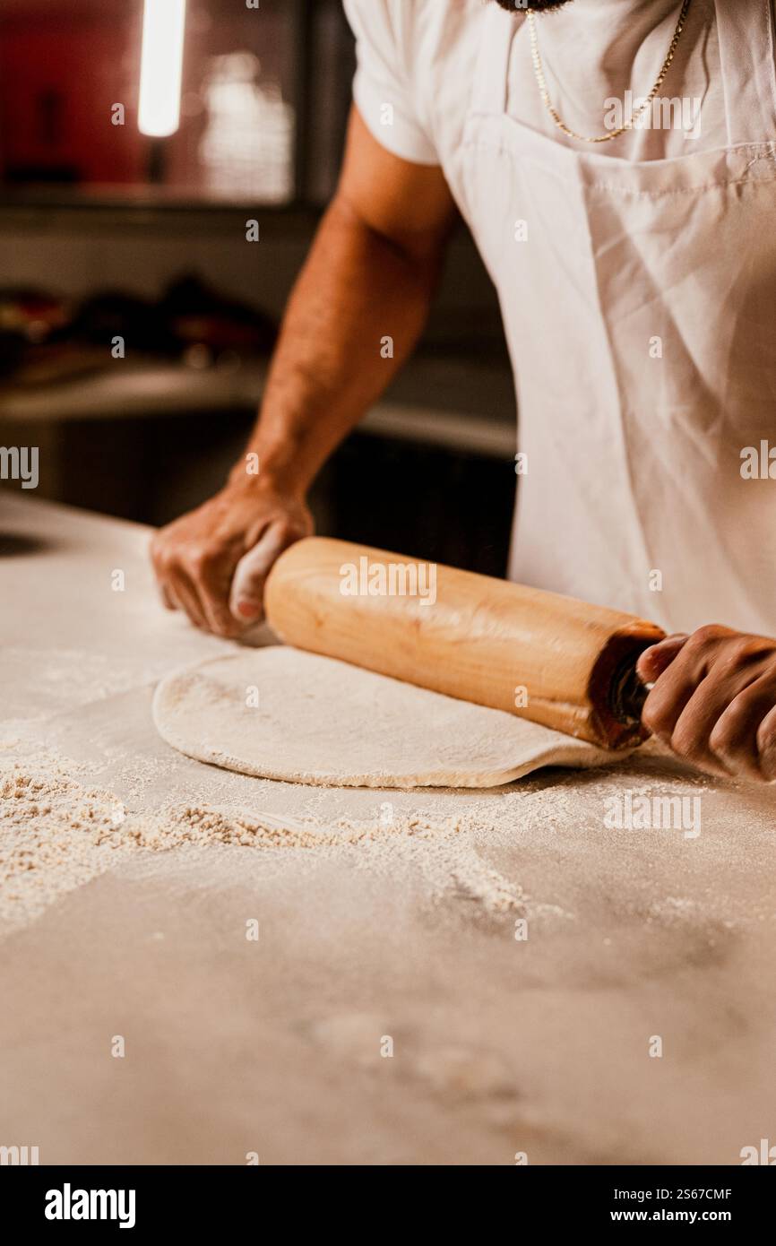 Restaurant kitchen man making dough hi-res stock photography and images ...