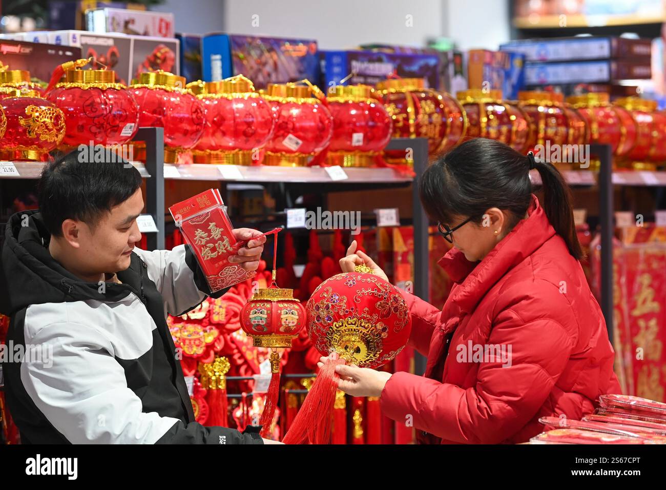People select Spring Festival decorations in a market in Chongqing ...