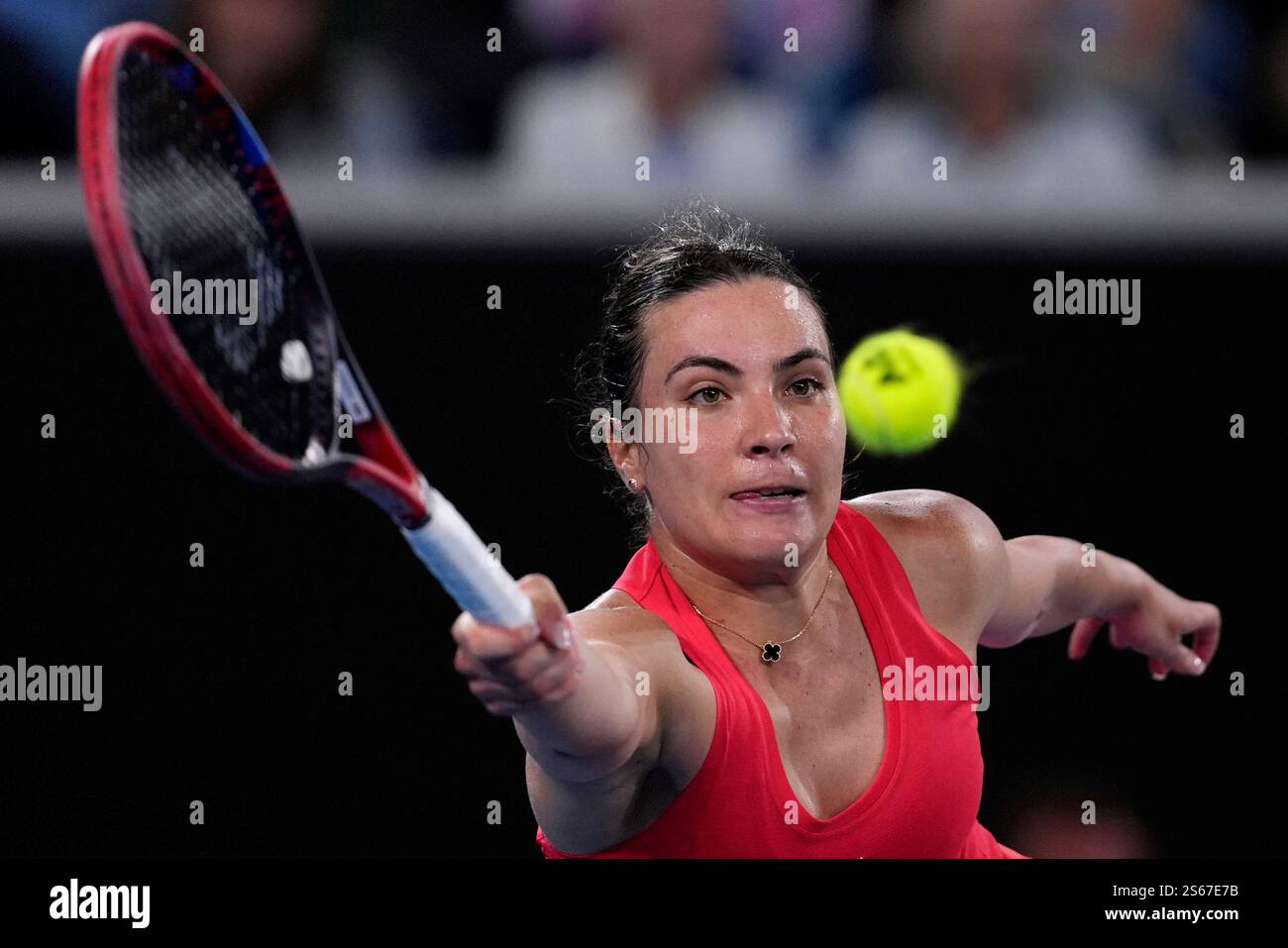 Elena-Gabriela Ruse of Romania plays a forehand return to Madison Keys of the U.S. during their ...