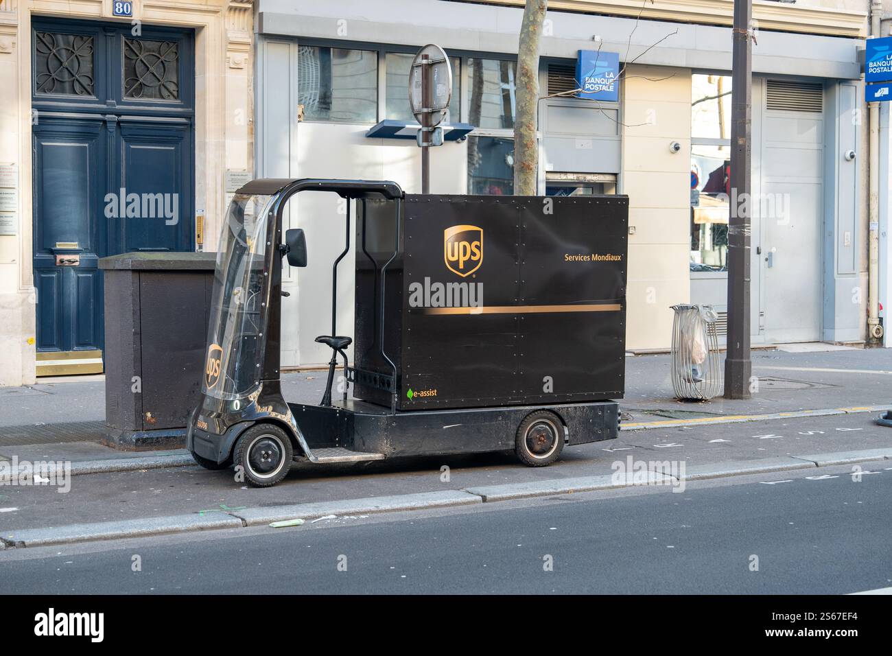 Delivery vehicle parked on city street in busy urban area during ...