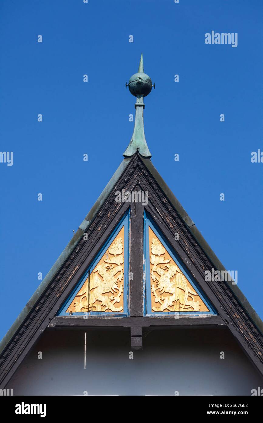 Old roof gable decorated with gold leaf on an old half-timbered house ...