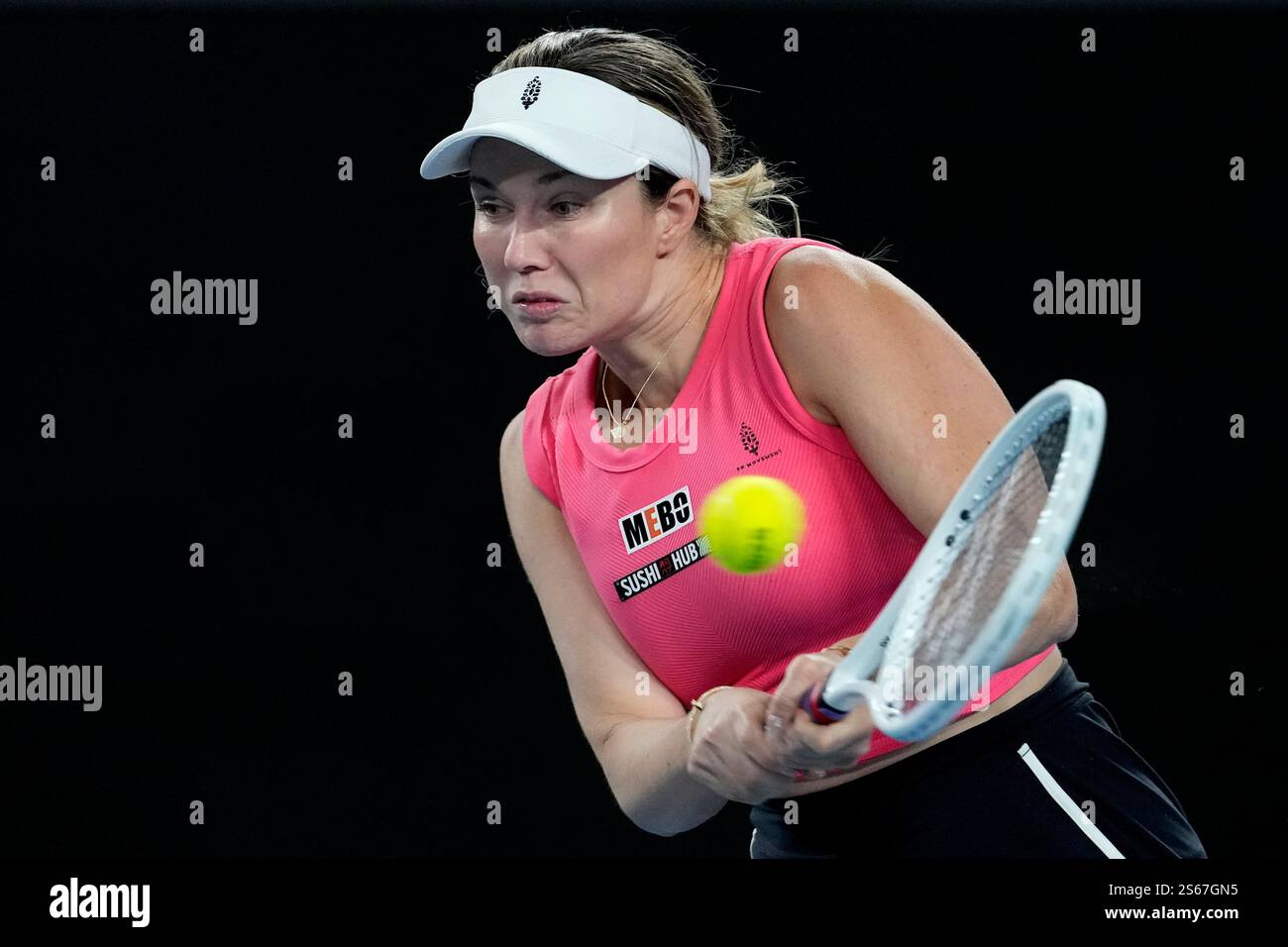 Danielle Collins of the U.S. plays a backhand return to Destanee Aiava ...