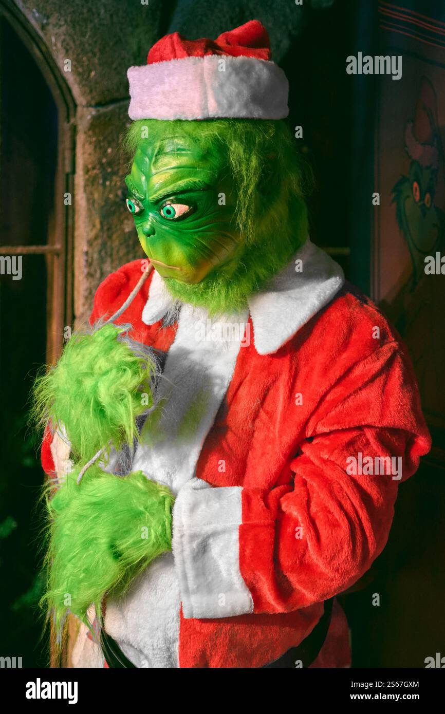 Madrid. Spain - January 16, 2025: Wax figure of the Grinch dressed in a ...