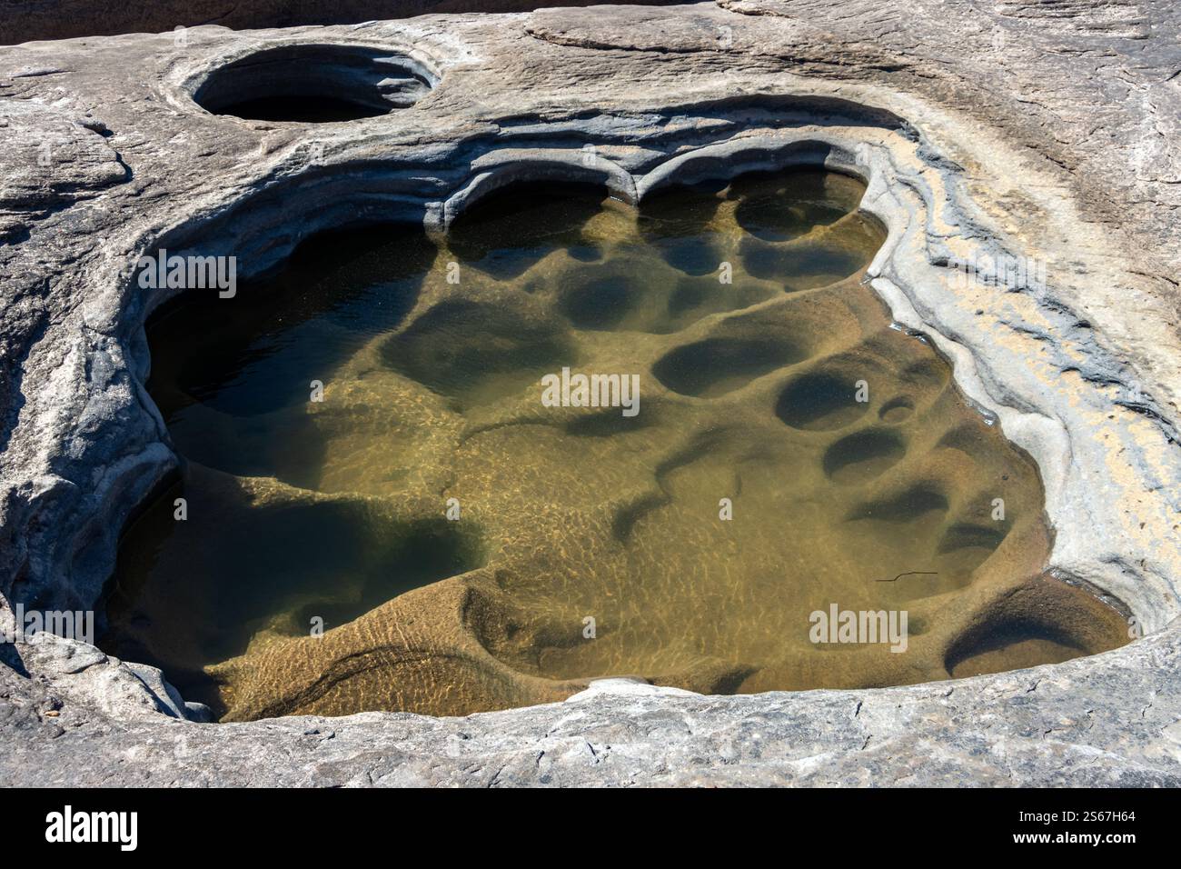 Water holes in an eroded riverbed, Sam Phan Bok, Thailand Stock Photo ...