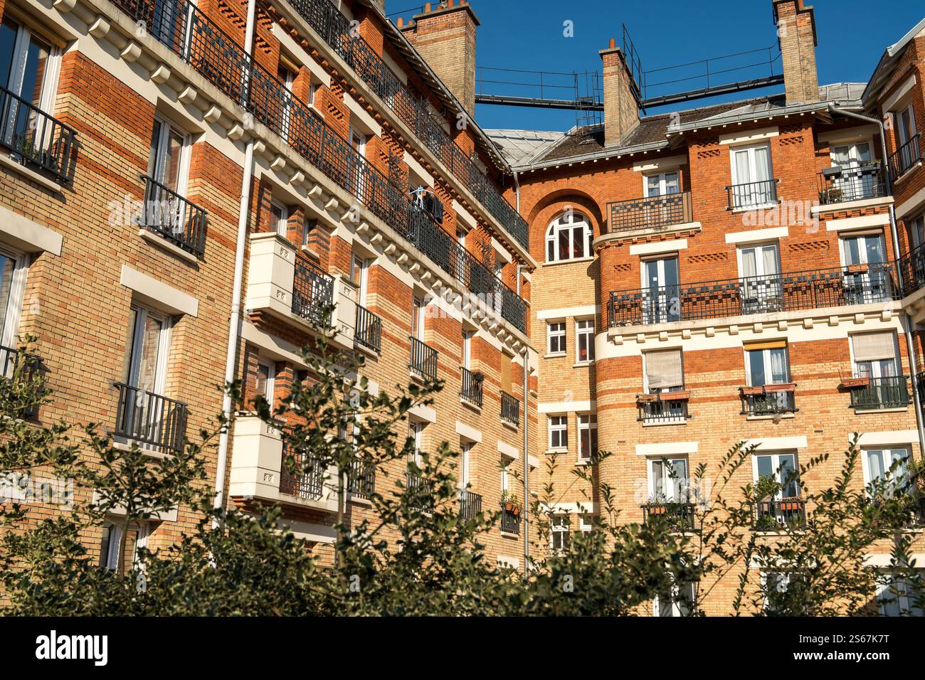 Charming brick apartment buildings in a sunny urban neighborhood of ...