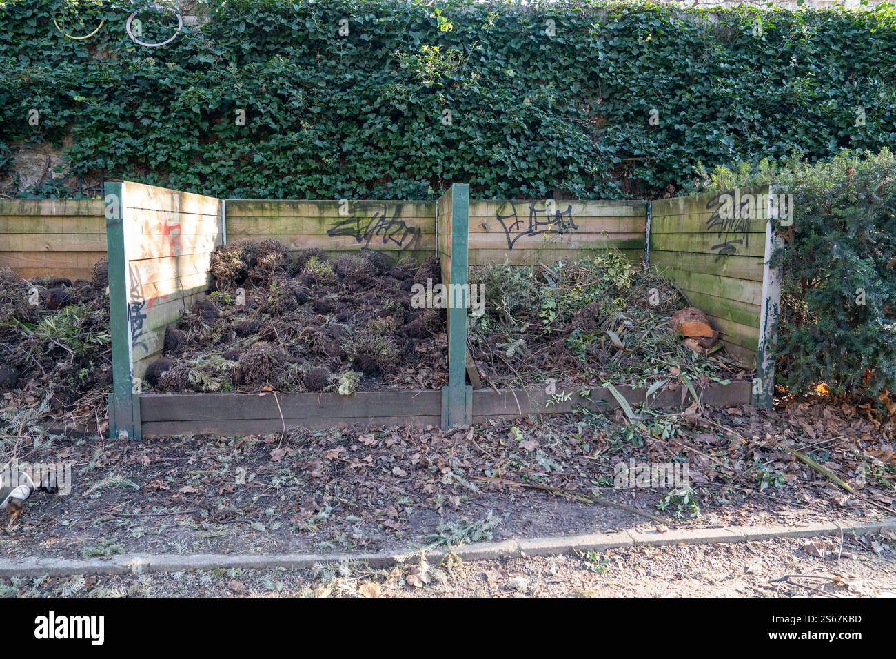 Compost bins filled with organic waste in a community garden area Stock ...