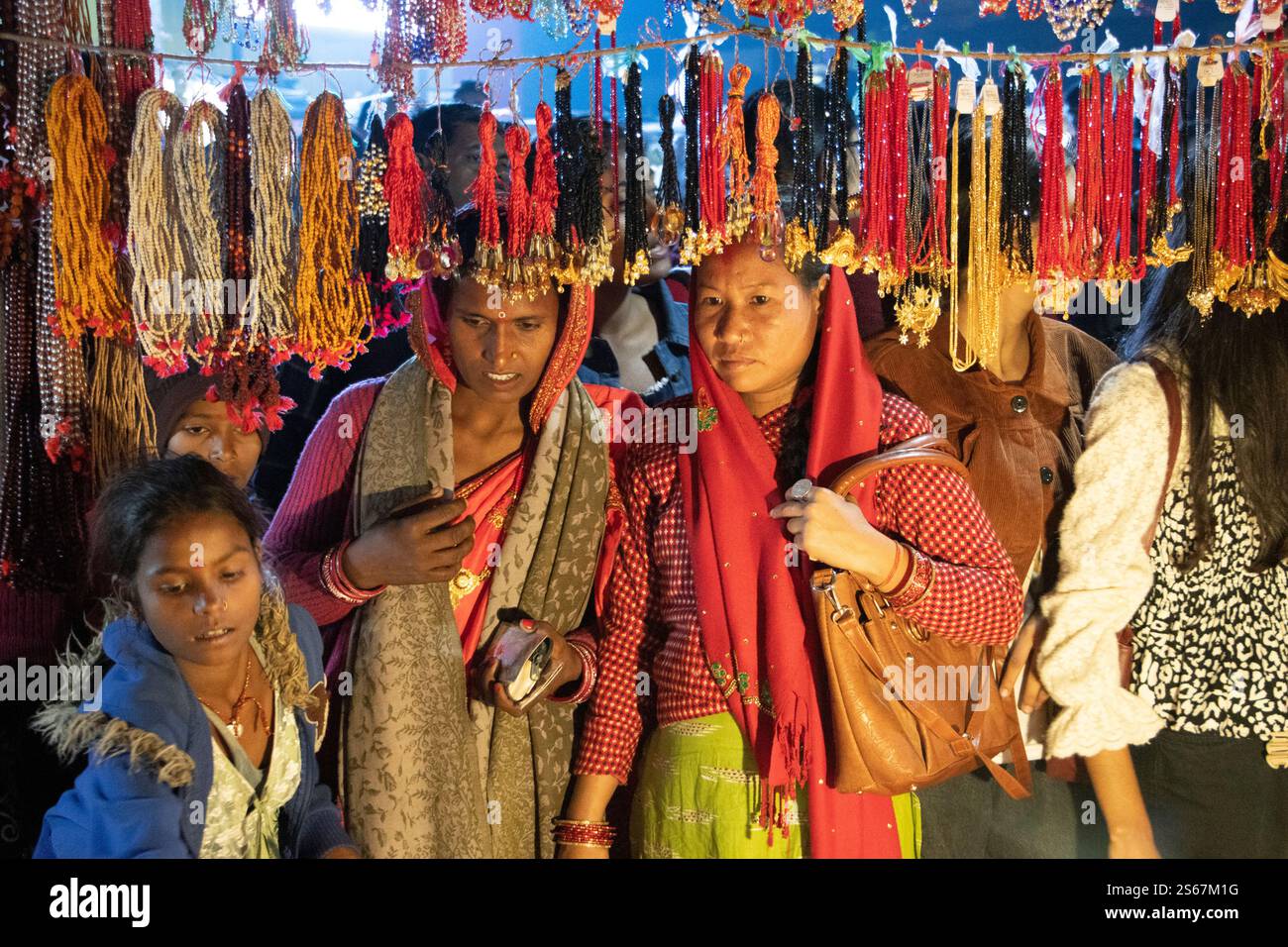 Pilgrims explore the night market outside Janaki Mandir. Janakpur Dham ...