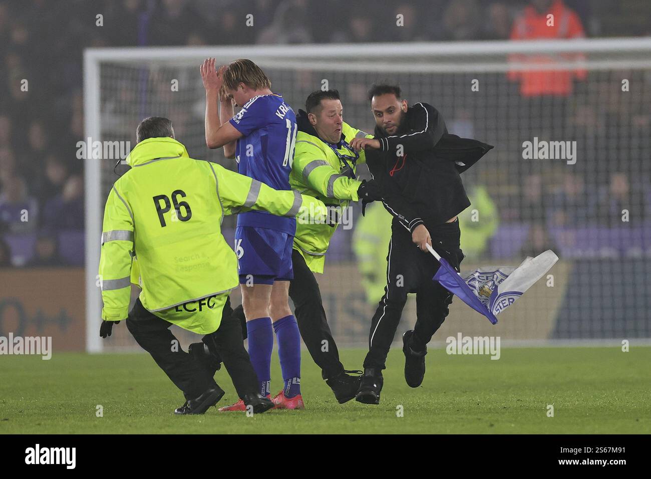 Leicester, UK. 15th Jan, 2025. Security tackle a pitch invader during ...