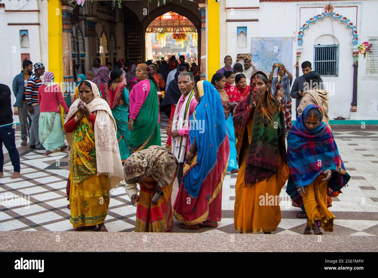 Pilgrims bow the steps to Janaki Mandir before entering the temple ...