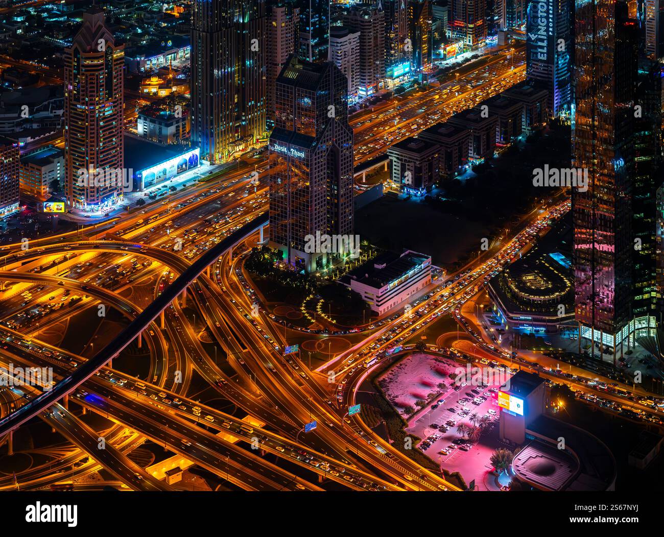 Bright lights of Dubai shot from Burj Khalifa. Skyscrapers intertwined ...