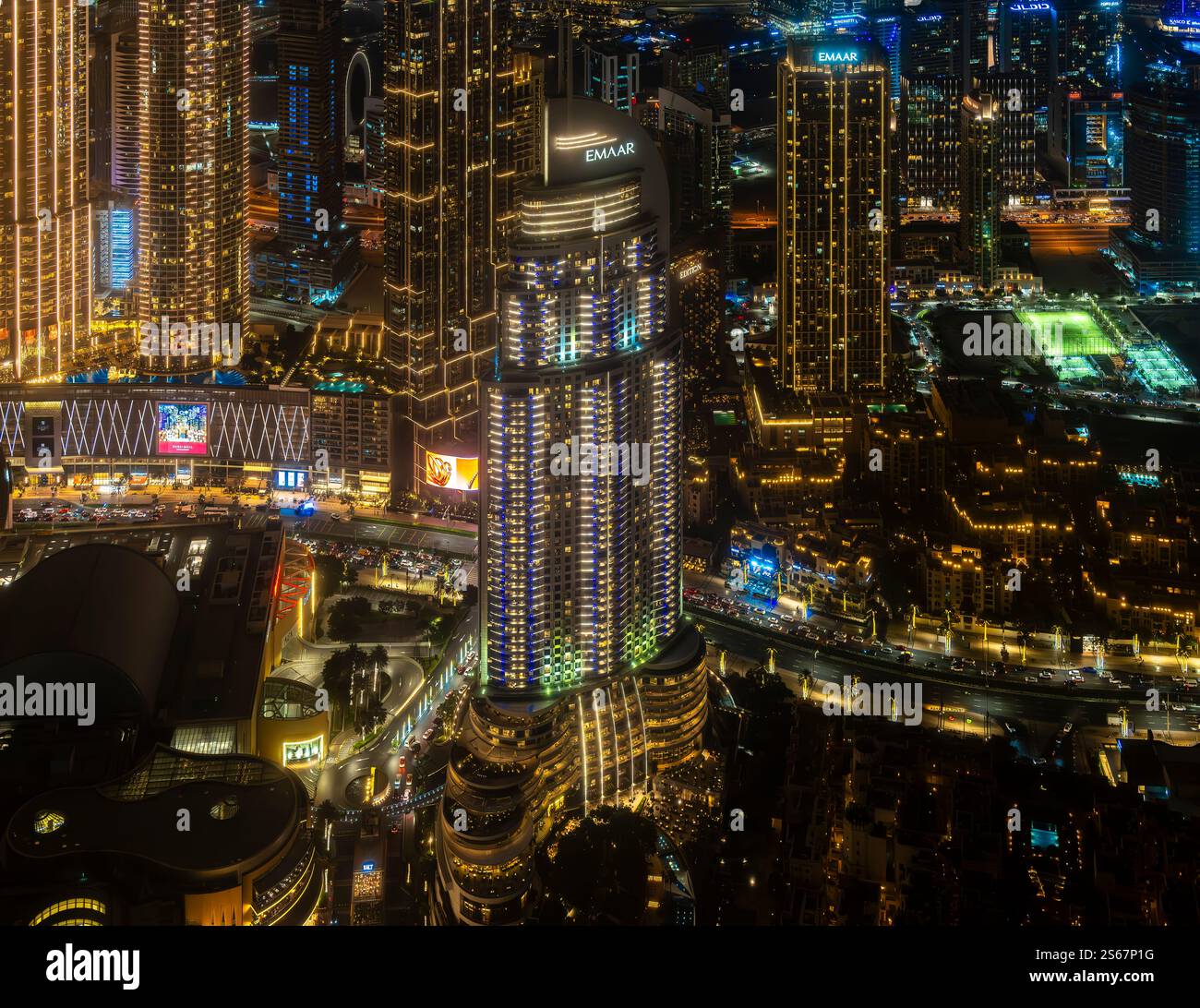 Bright lights of Dubai shot from Burj Khalifa. Skyscrapers intertwined ...