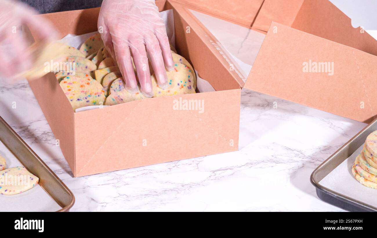 Packing Sprinkle-Adorned Sugar Cookies into Boxes Stock Photo - Alamy