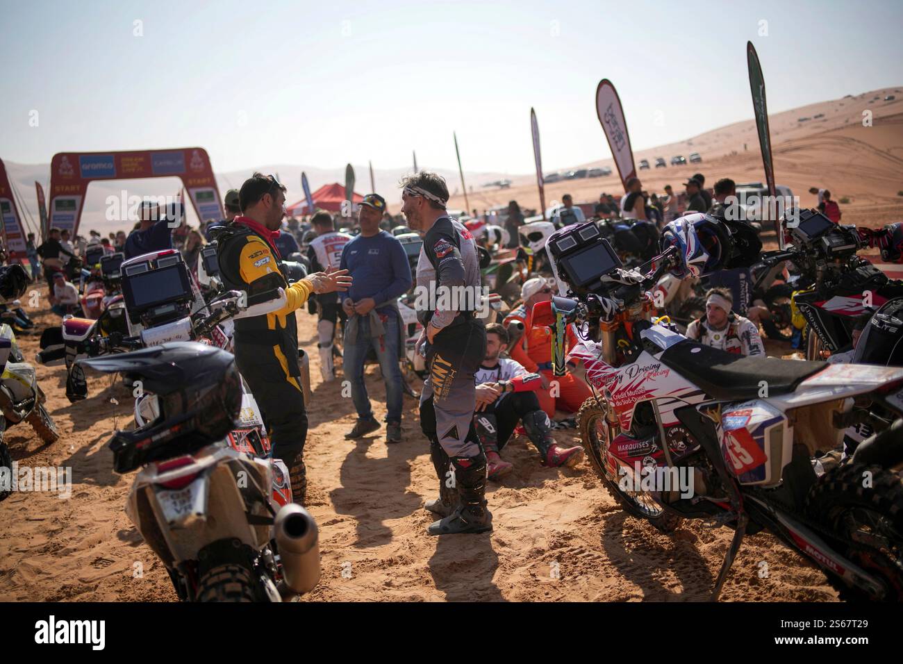 Riders wait at the start delayed due to fog during the eleventh stage ...
