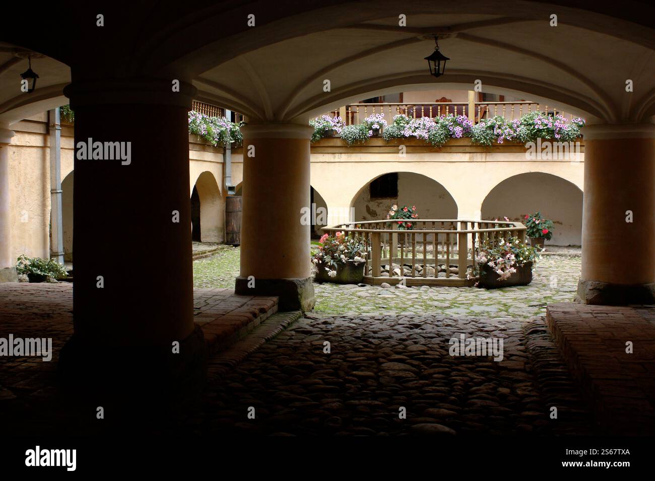 View of a romantic inner courtyard of an old European castle with ...