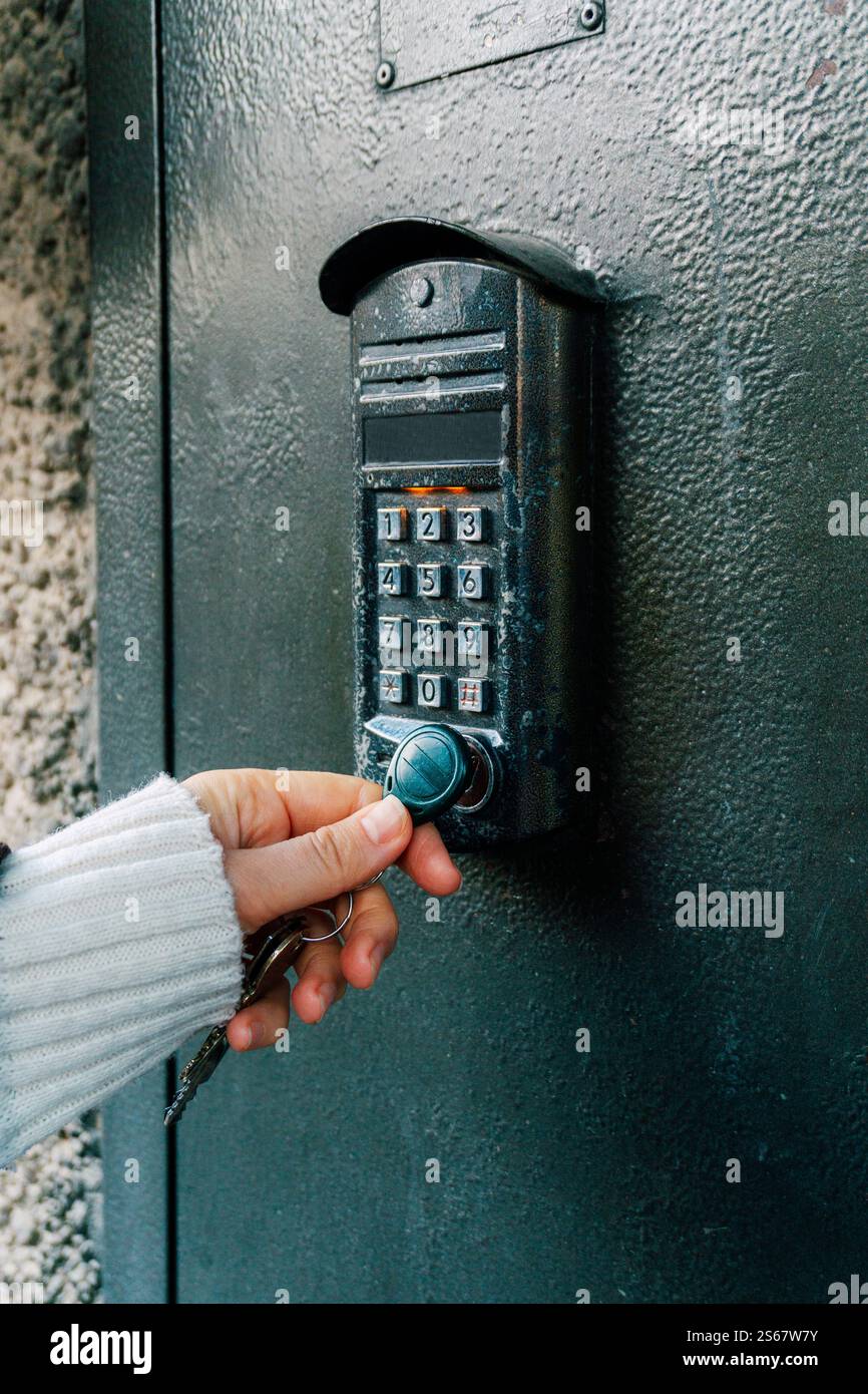 Magnetic intercom in an apartment building. Opening the front door lock ...
